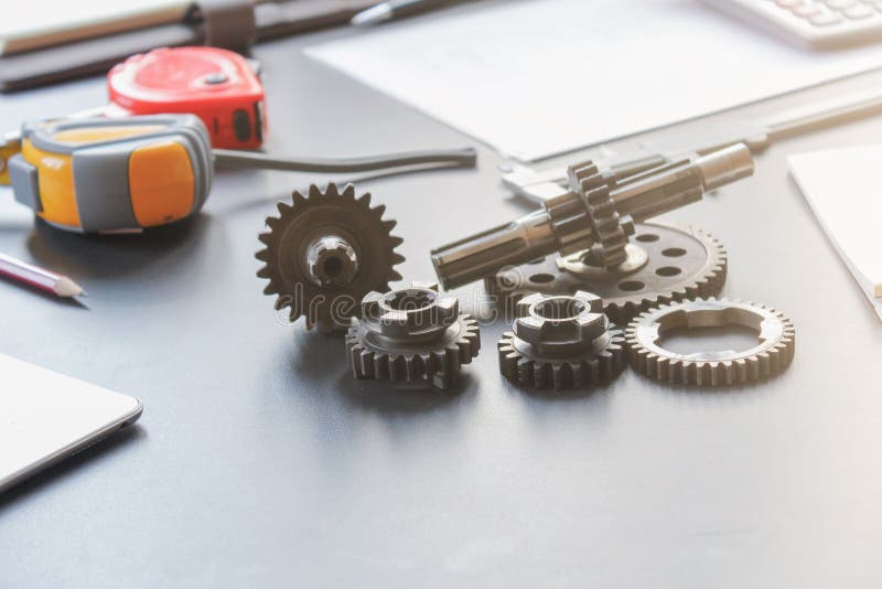 The Gear Set is Placed on the Workbench of a Team of Factory Mechanical ...