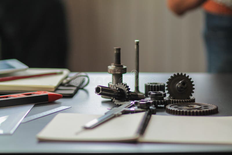 The Gear Set is Placed on the Workbench of a Team of Factory Mechanical ...