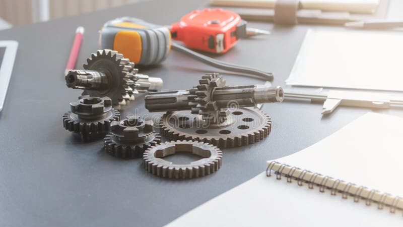 The Gear Set is Placed on the Workbench of a Team of Factory Mechanical ...