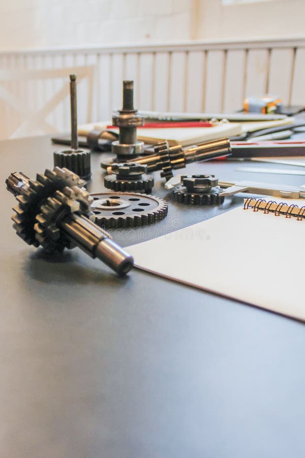 The Gear Set is Placed on the Workbench of a Team of Factory Mechanical ...