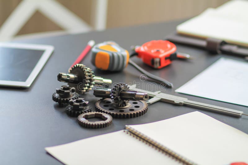 The Gear Set is Placed on the Workbench of a Team of Factory Mechanical ...