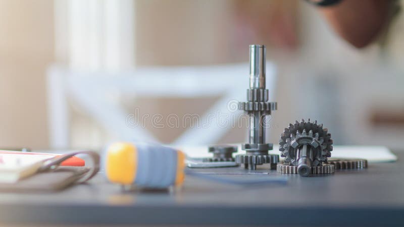 The Gear Set is Placed on the Workbench of a Team of Factory Mechanical ...