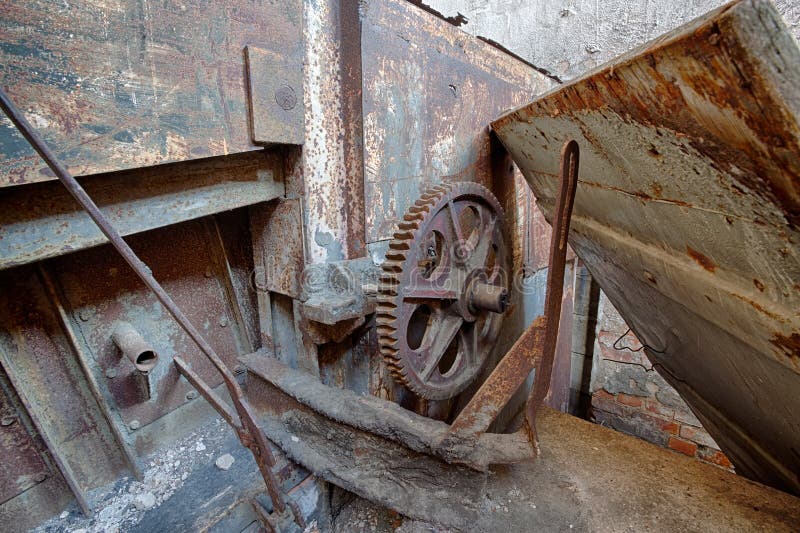 The Gear Wheel of a Rusty Old Machine in Brick Factory Stock Photo ...