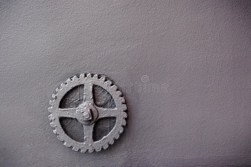 Gear Wheel on the Wall Painted in Dark Gray Color. Stock Image - Image ...