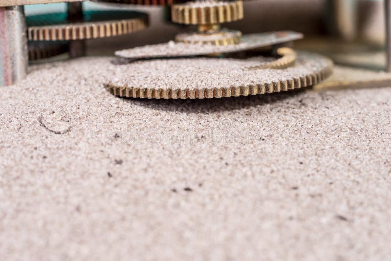 Gear wheels in the sand stock photo. Image of factory - 110393296