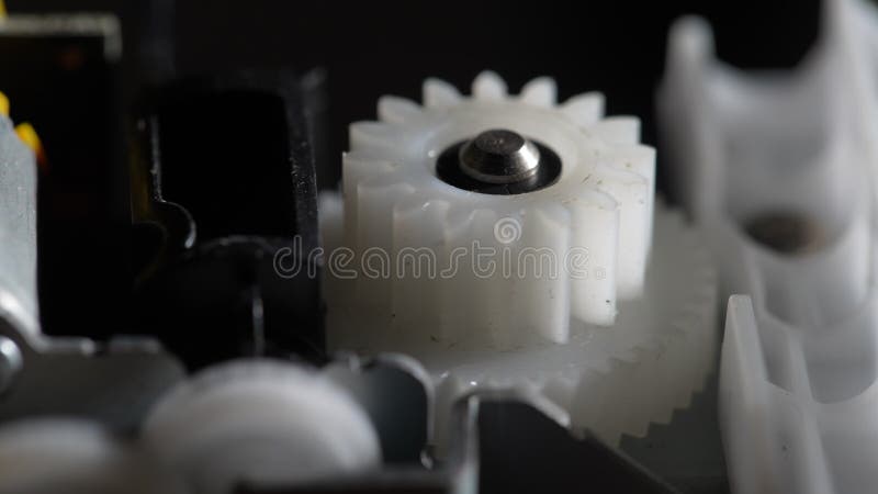 Gears Rotating in Mechanical Device. Machine White Plastic Gears ...