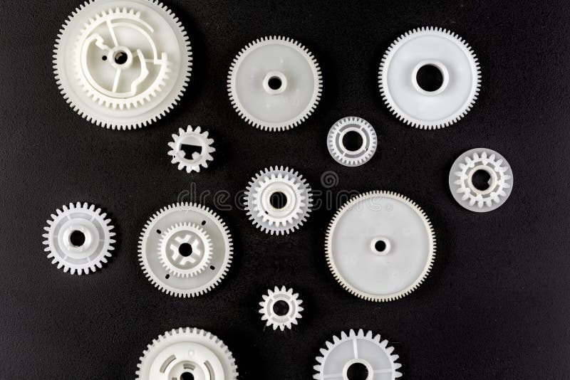 Gears Made of Polymer Materials on a Black Background are Used for ...