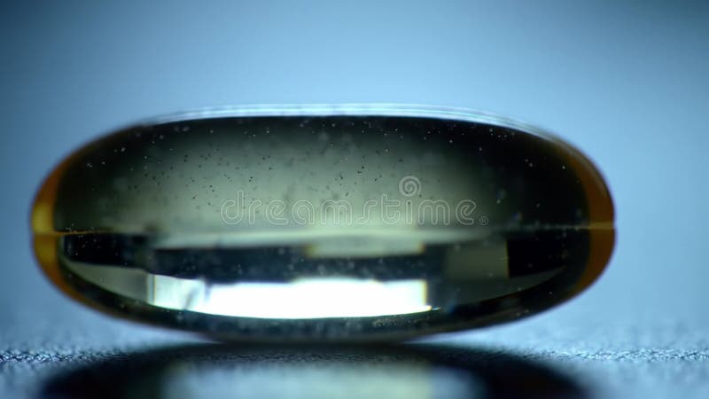 Close-up Examination of a Gelatin Capsule Showcasing Its Texture and ...