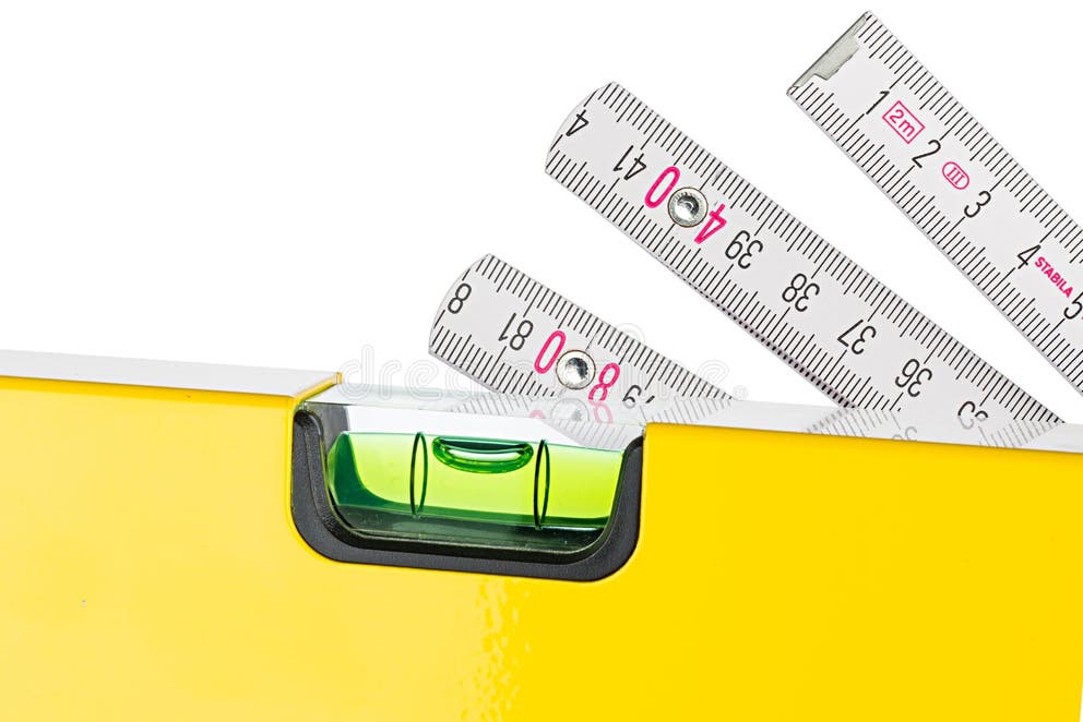 Gele waterpas en vouwmeter stock afbeelding. Image of instrument - 89534863