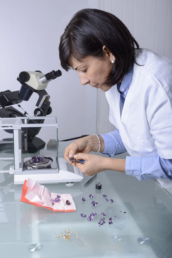 Analysis of gemologist stock image. Image of emerald - 36793239