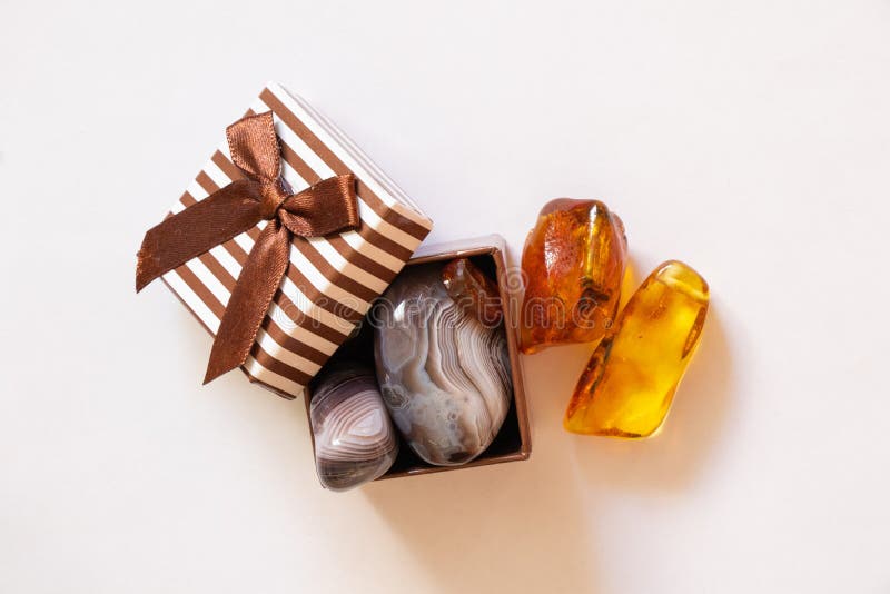 Gemstones Amber Agate in a Gift Box on a White Background Stock Image ...