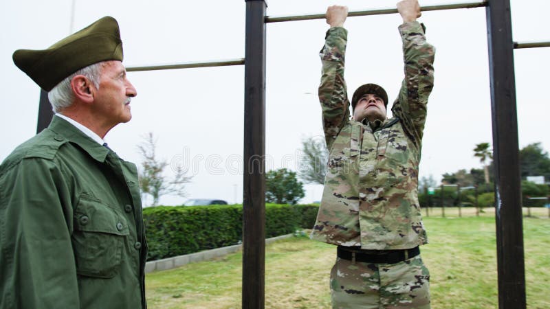 General Checks the Physical Test of the Military Cadet with Pull-ups ...