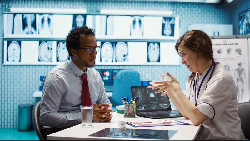 General Practitioner Consults Patient about Diagnostic Test Results ...