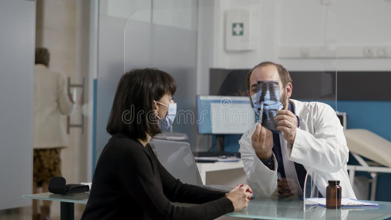 General Practitioner Explaining Bones Radiography Scan Stock Image ...