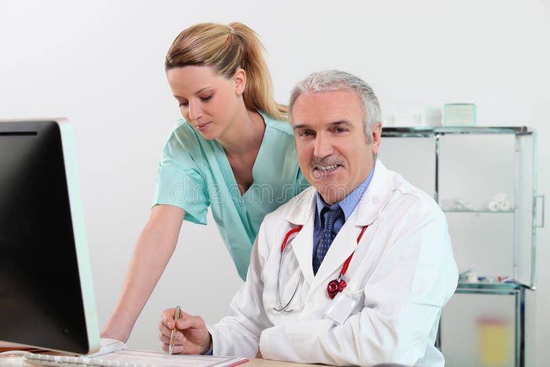 General Practitioner and Female Nurse Stock Image - Image of medicine ...