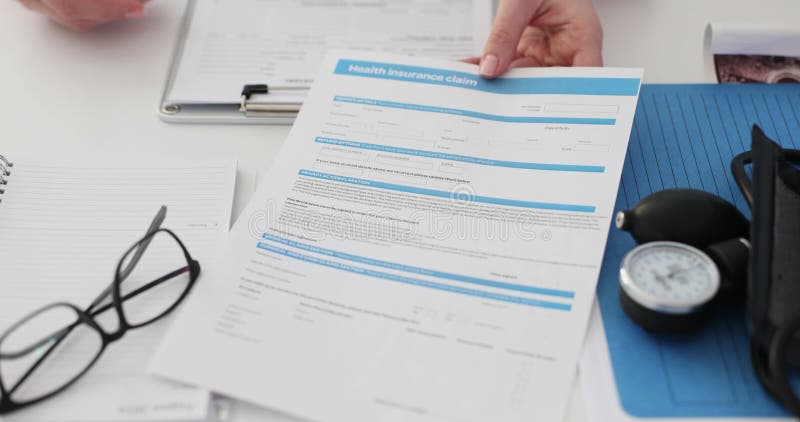 General Practitioner Has a Document Confirming Payment of Insurance ...