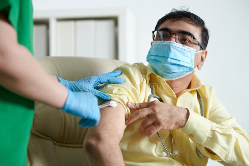 General Practitioner Getting Injection Stock Photo - Image of male ...