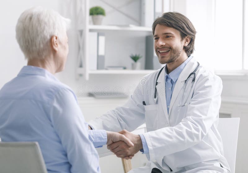 General Practitioner Shaking Hands with Healthy Patient Stock Image ...