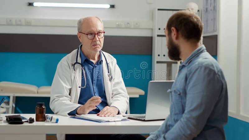 General Practitioner Taking Notes on Medical Documents Stock Image ...