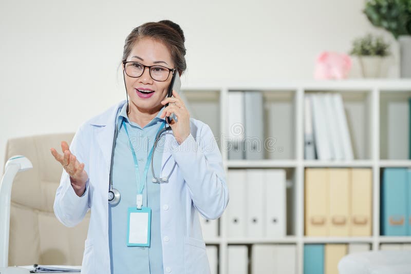 General Practitioner Talking on Phone Stock Image - Image of illness ...