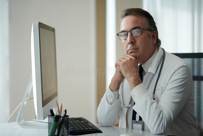 General Practitioner Working on Computer Stock Photo - Image of office ...