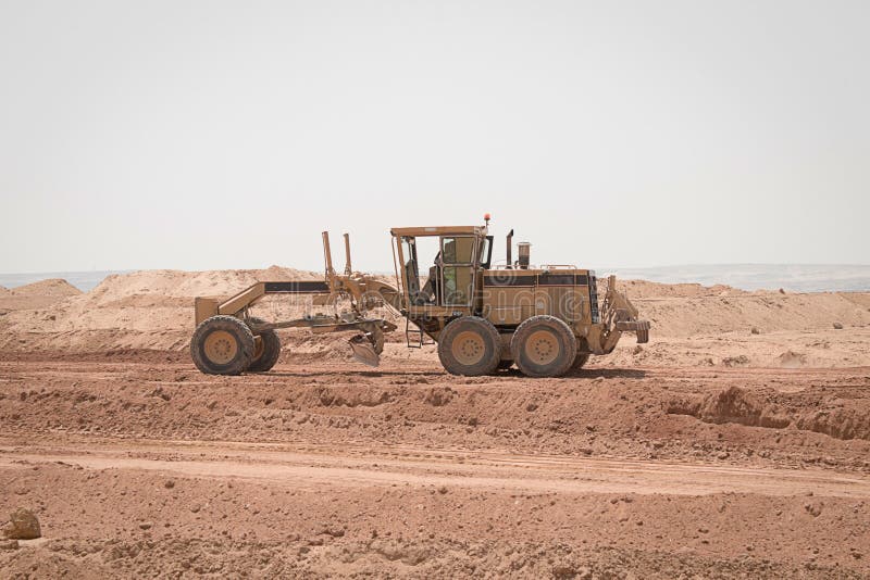 Grader Making Earthwork in a Construction Site Stock Photo - Image of ...