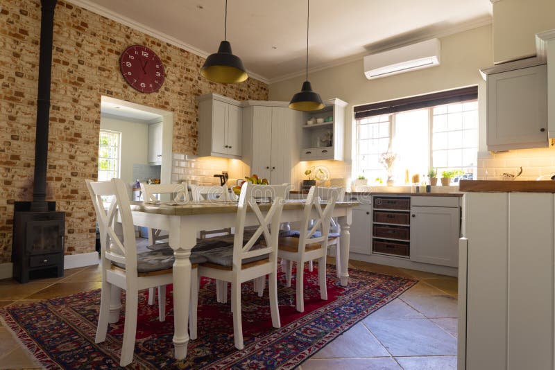 General View of Kitchen Interior with Cupboards, Countertop and Table ...