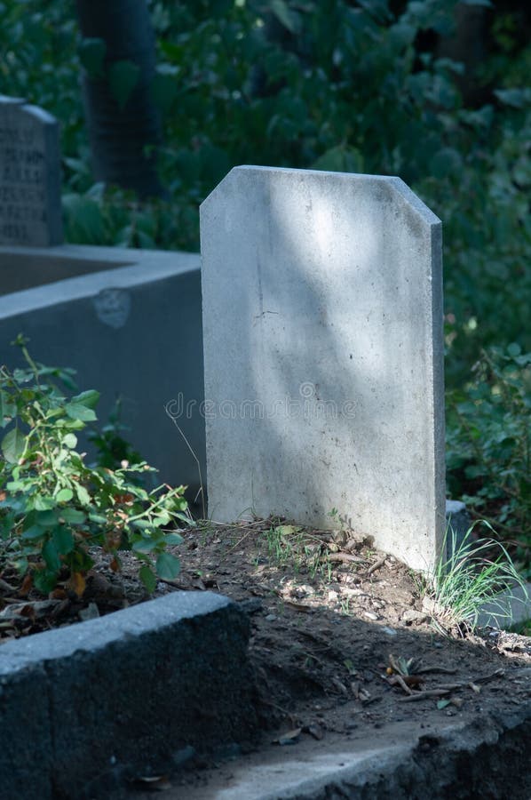 Unmarked Blank Grave Stone stock photo. Image of ground - 310321408