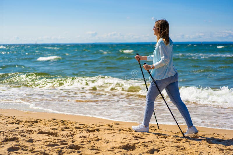 Nordic Walking - Beautiful Woman Exercising on Beach Stock Photo ...