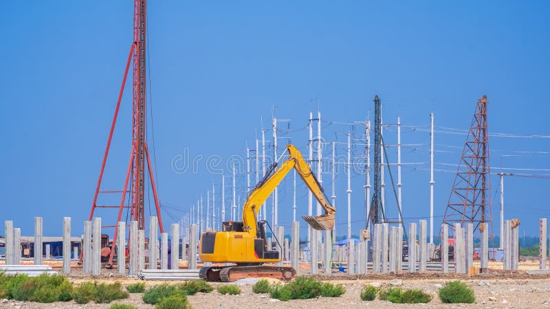 Excavator with Pile Driver are Working To Installing Precast Concrete ...