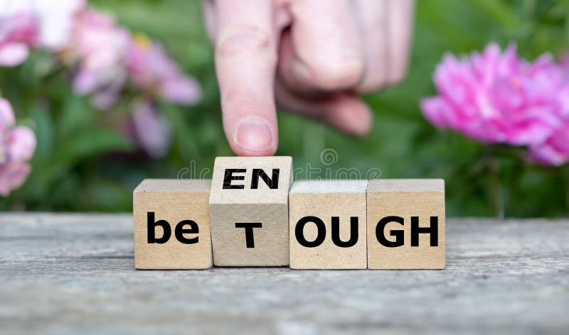 Hand Turns Wooden Cube and Changes the Expression Be Tough To Be Enough ...