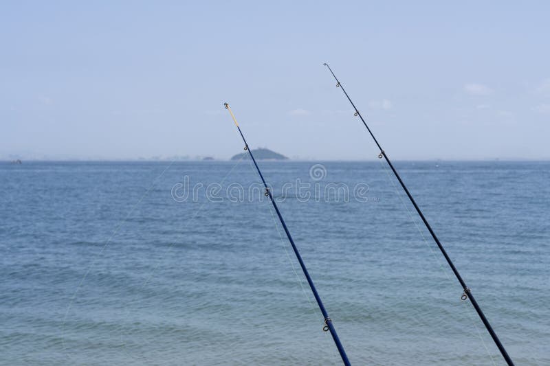 Fishing Rod on the Beach Against the Sea Stock Image - Image of boat ...