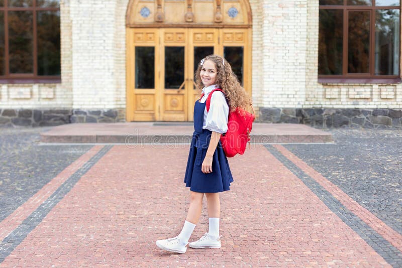 Portrait Young Happy Cute Girl with Curly Hair and in a School Uniform ...