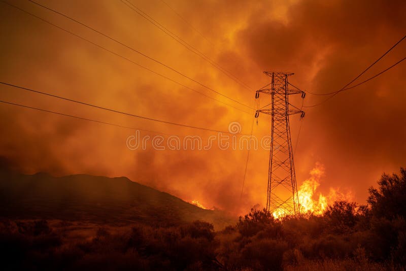 Electrical Transmission Tower Surrounded by Wildfire and Smoke Stock ...