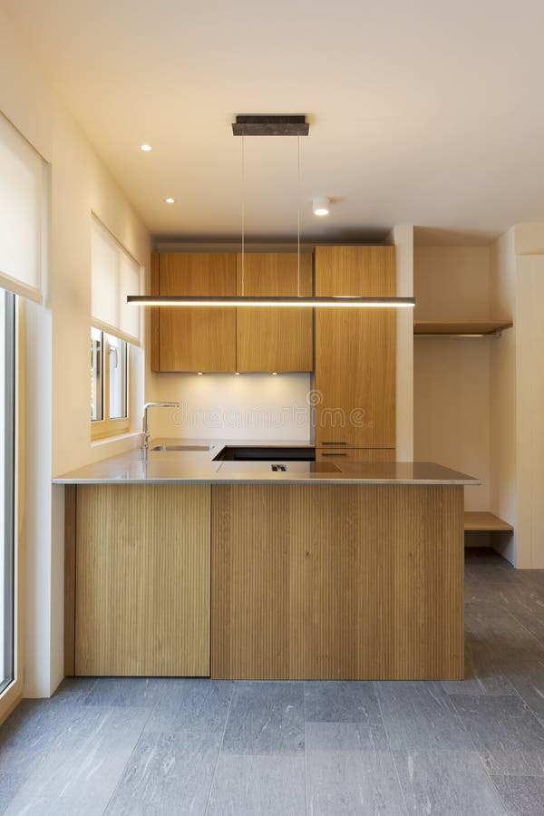 Front View of a Modern Wooden Kitchen with an Induction Hob. Stock ...