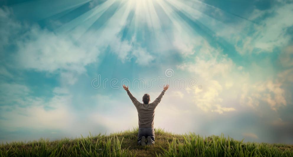 Praising the Lord. a Man with His Arms Raised To the Sky in ...