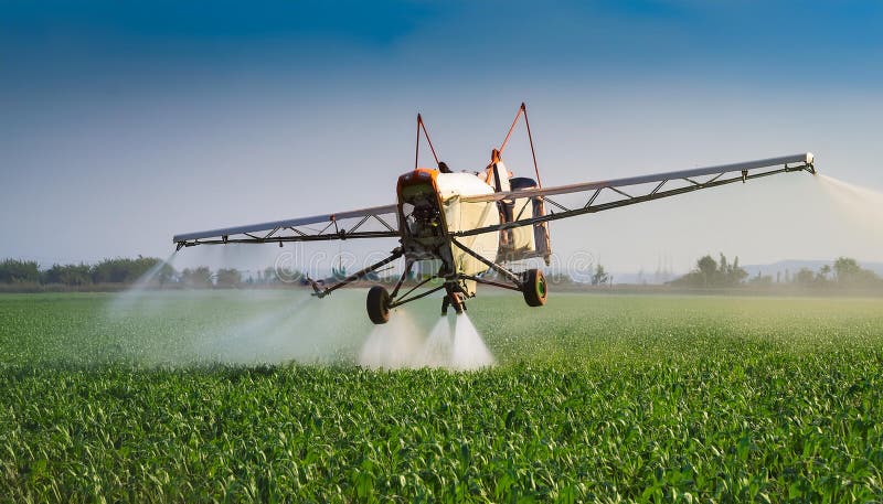 Spraying Insecticide. Crop Duster Spraying a Crop, Taken Using a ...