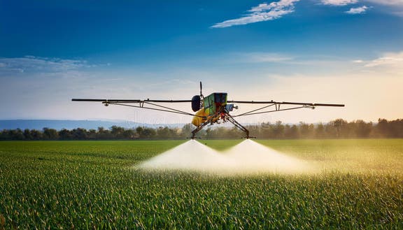 Spraying Insecticide. Crop Duster Spraying a Crop, Taken Using a ...