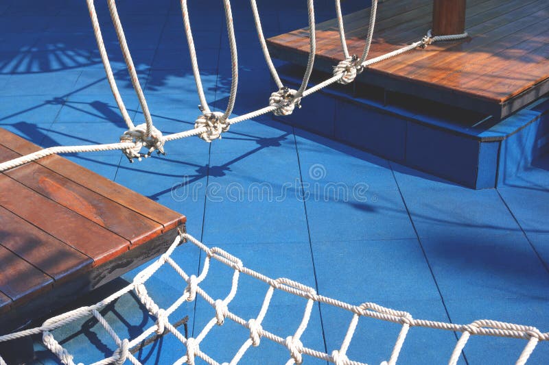 Climbing Rope with Vintage Outdoors Wooden Playground Equipment on Blue ...