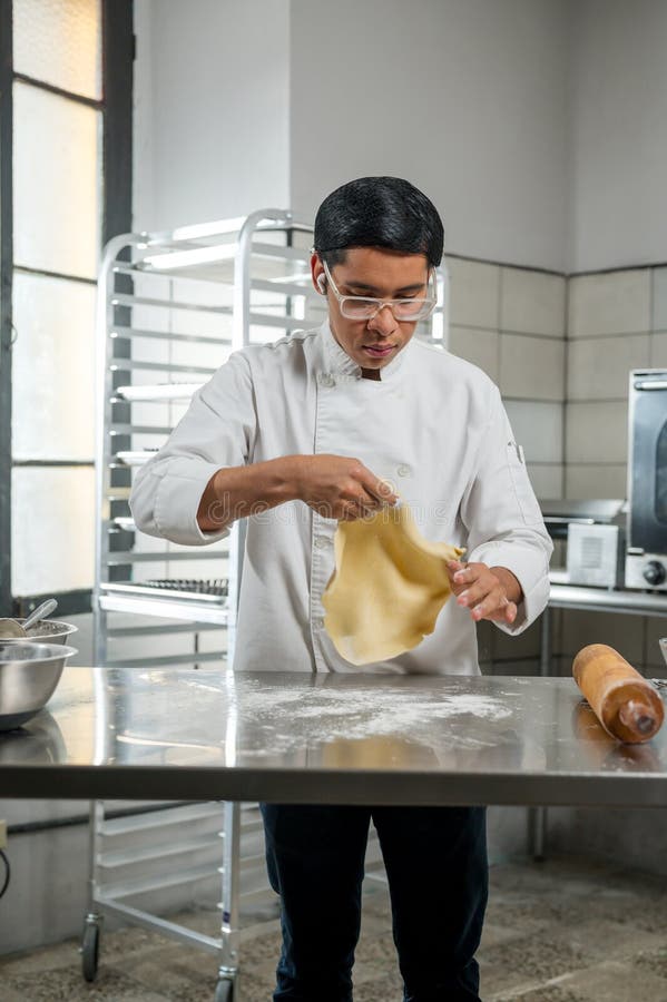 The Baker Stretches the Dough To Make a Dessert. Stock Photo - Image of ...