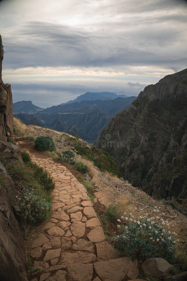 Scenic Mountain Pathway Overlooking the Ocean with Dramatic Clouds ...