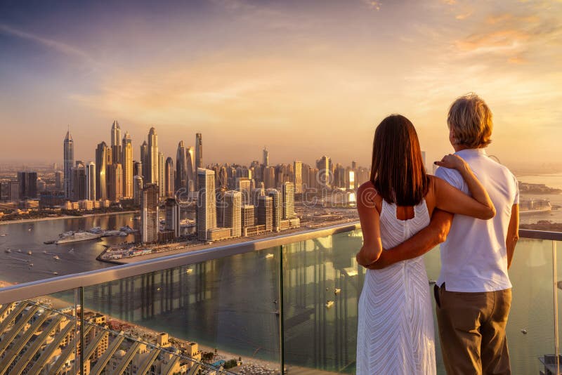A Hugging Couple Enjoys the Sunset View of the Dubai Marina Stock Photo ...