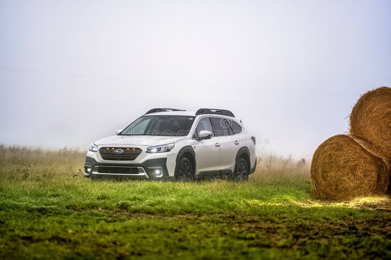 White Subaru Outback SUV in Autumn on a Meadow in the Fog Editorial ...