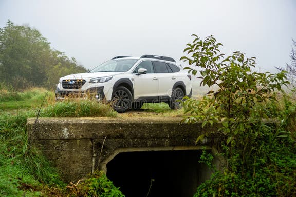 White Subaru Outback SUV in Autumn on a Meadow in the Fog Editorial ...