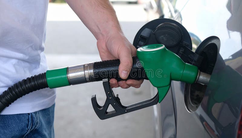 Pumping Gas. Close Up of Man Pumping Fuel in Car at Gas Station Stock ...