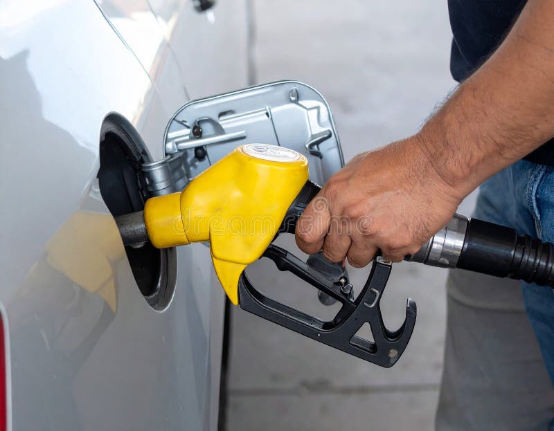 Pumping Gas. Close Up of Man Pumping Fuel in Car at Gas Station Stock ...
