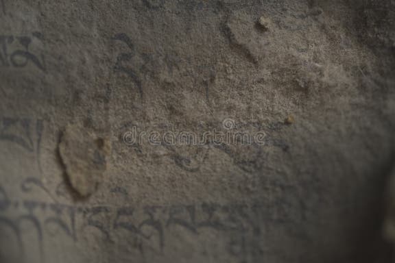 Macro of Weathered Tibetan Scripture with Faded Ink and Dust, Revealing ...