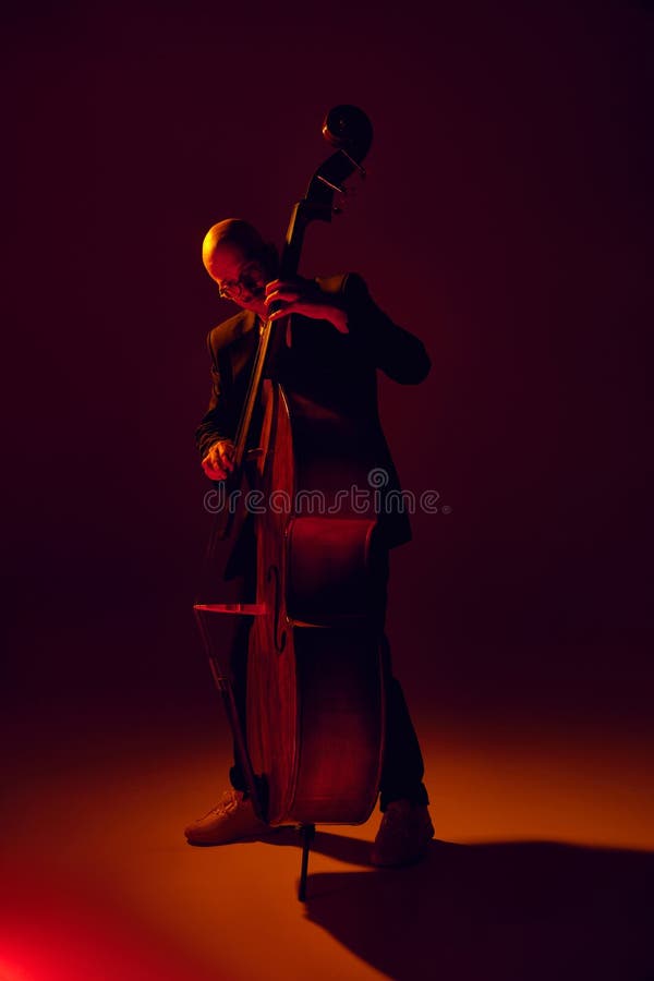 Bald Man, Talented Bassist Performing Jazz Compositions in Red-yellow ...