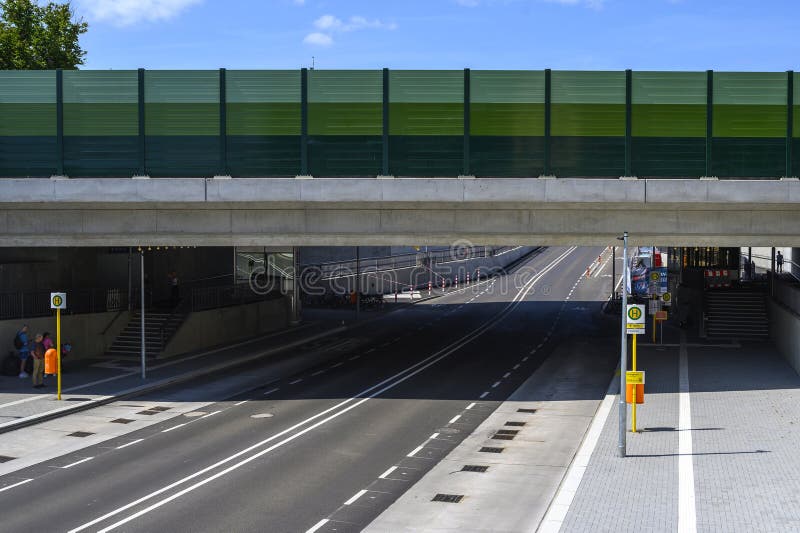 Modern Street with Cycle Path and Sidewalk, Which Passes Under a Bridge ...