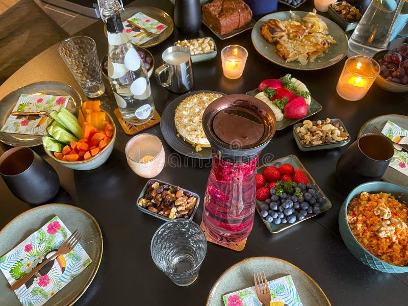 Black Table in a Living Room with Crockery and a Large Selection of ...